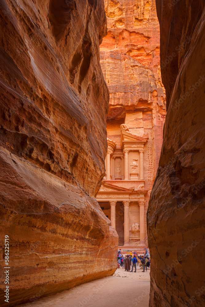 view of Al-Khazneh tomb from Sif Gorge, symbol of the city of Petra ...