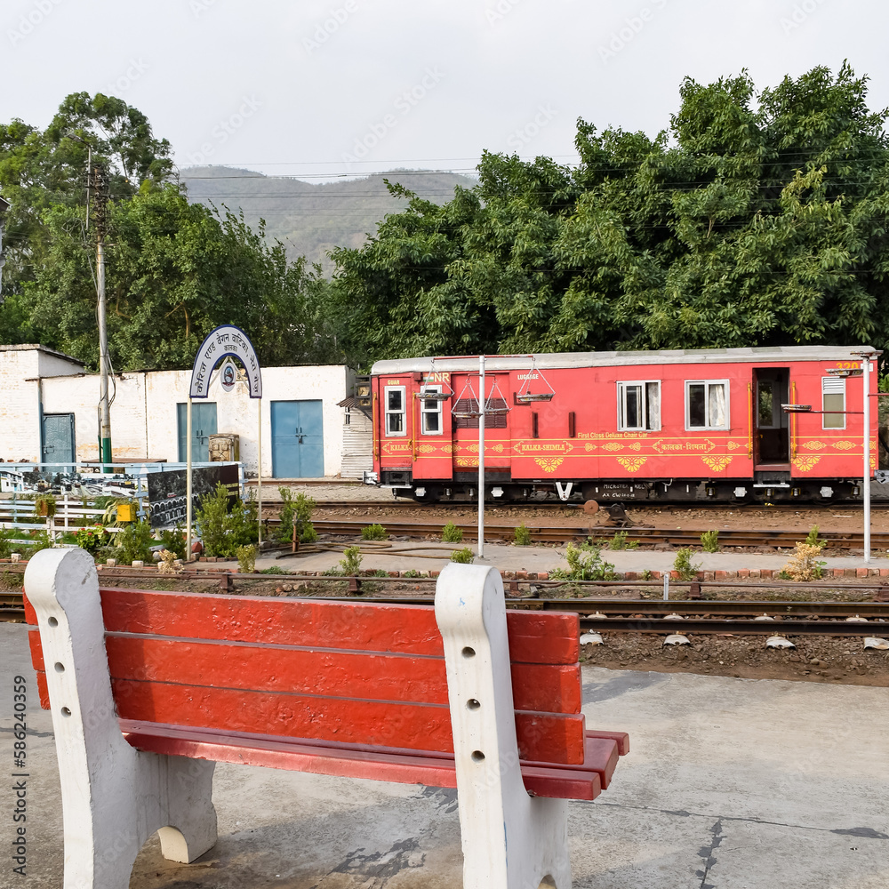 View of Toy train coach from the middle of railway track during daytime ...