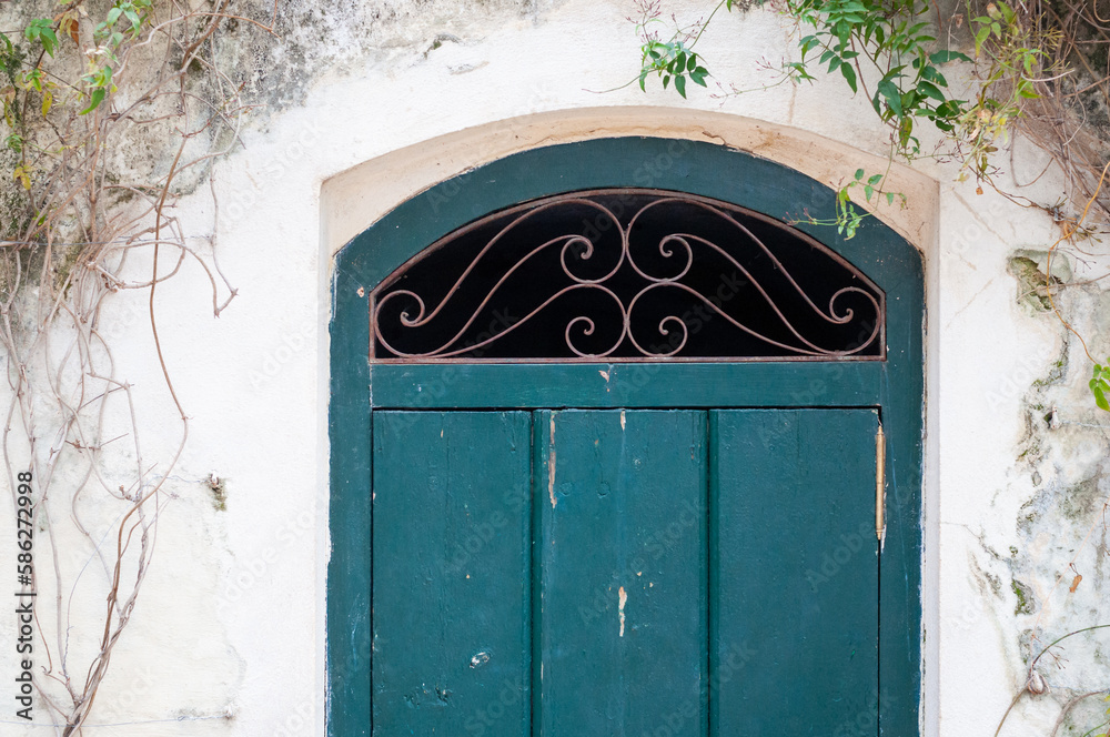 Closed turquoise green wooden door as a detailed background image ...