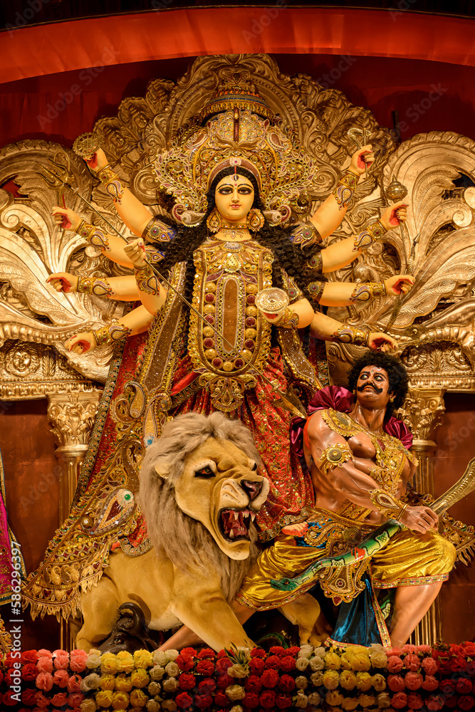 Idol of Goddess Devi Durga at a decorated puja pandal in Kolkata, West ...