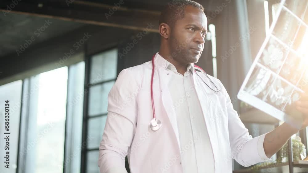 Portrait of doubtful mature african american doctor therapist with ...