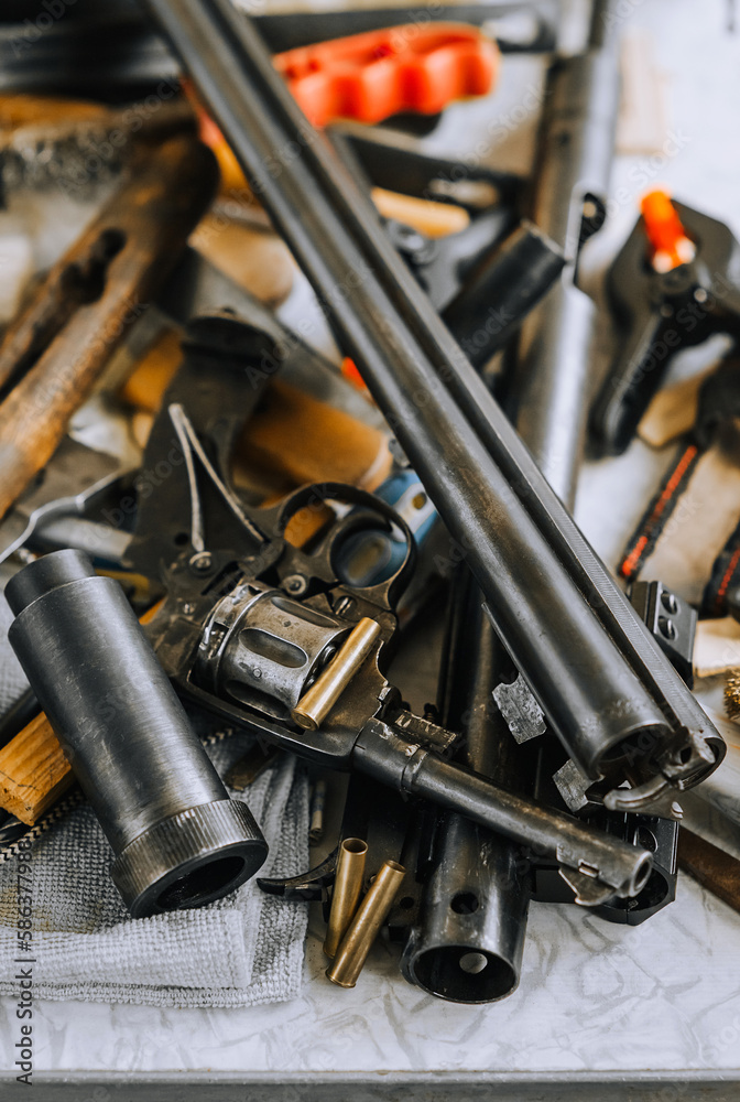 Retro weapons, a rifle with ammunition, a revolver with cartridges ...