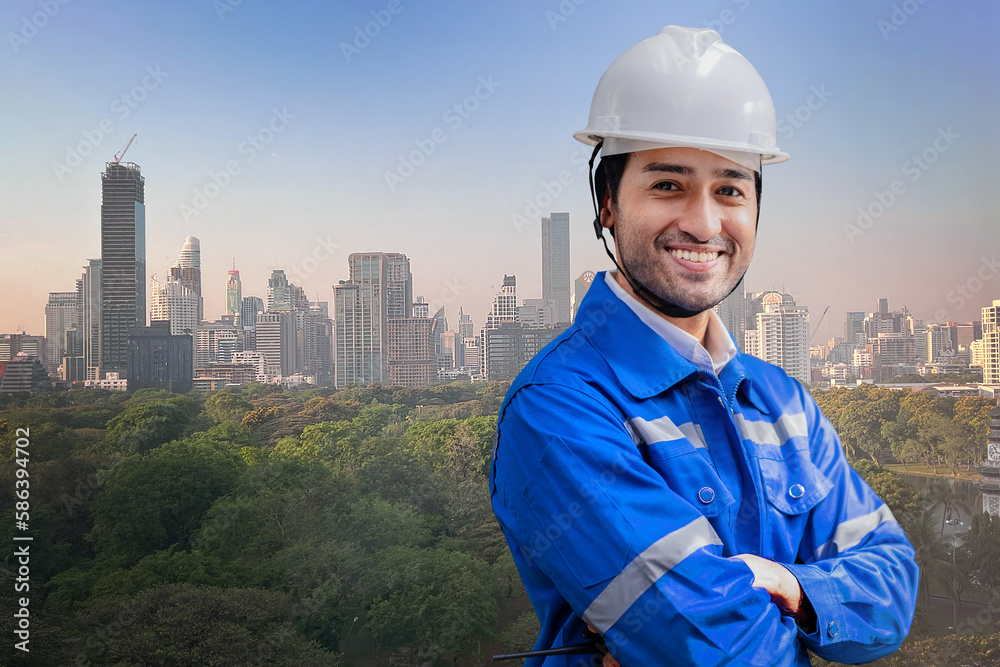 Portrait of manual Indian man worker is standing with confident with ...