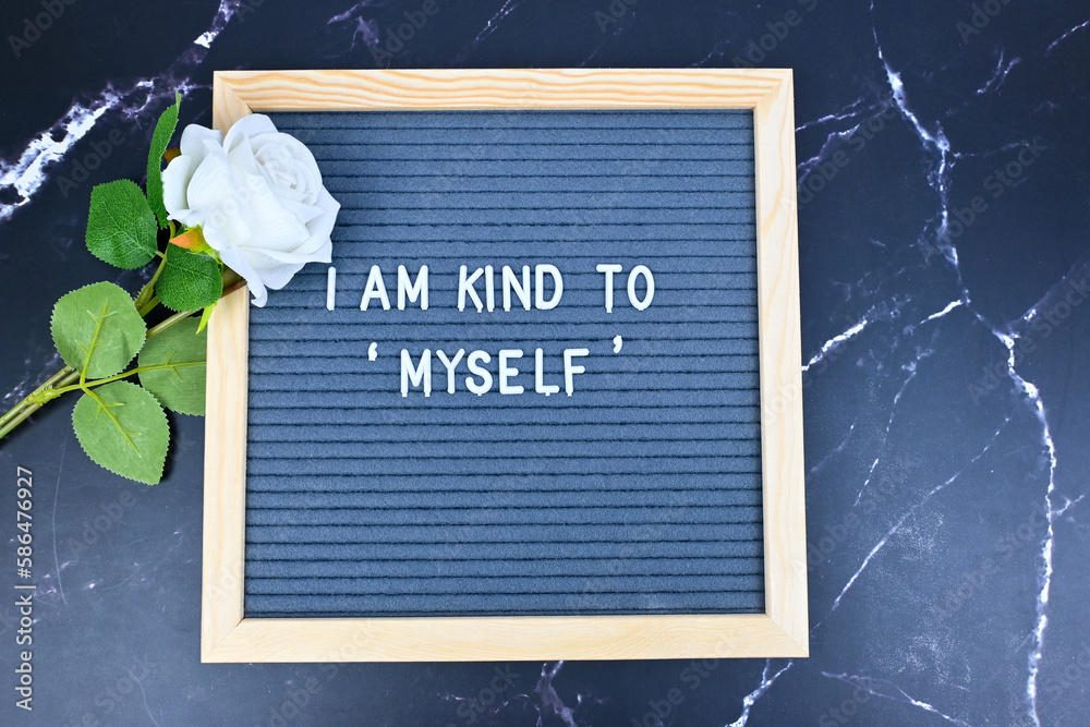 Grey letter board with phrase Self care, I am kind to myself. Self love ...