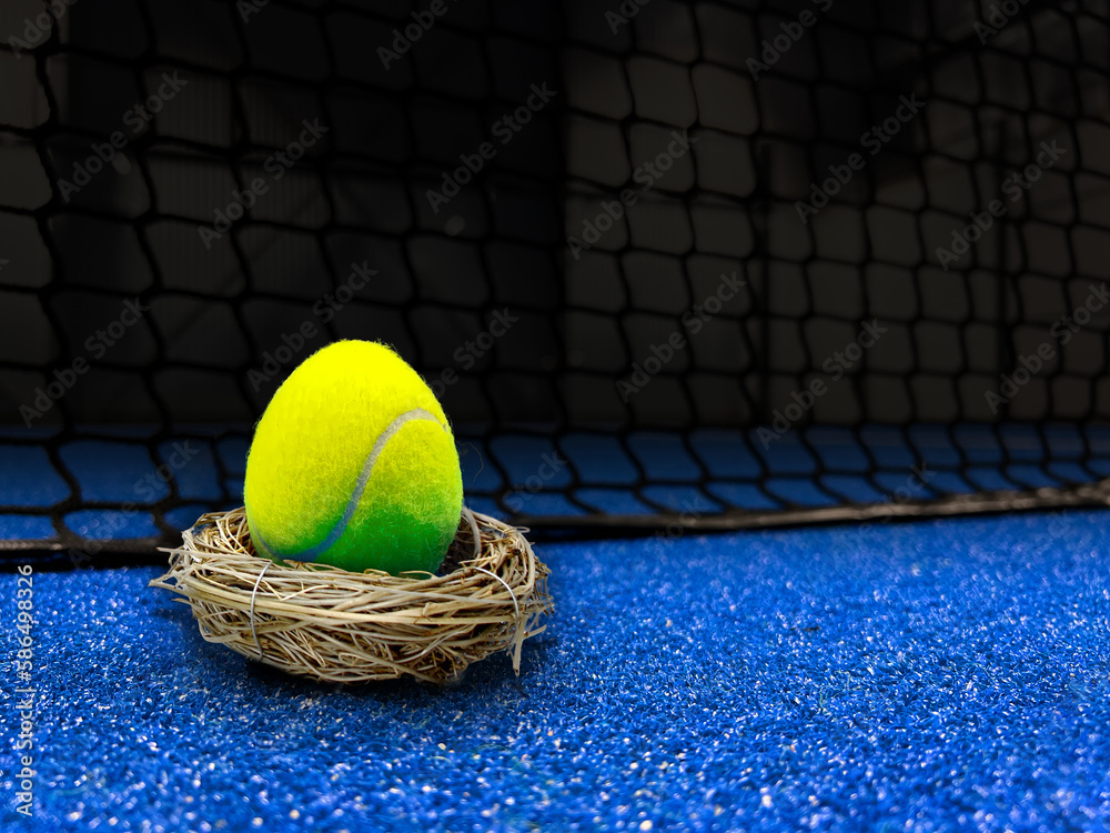 Foto de Padel easter egg ball on court do Stock | Adobe Stock