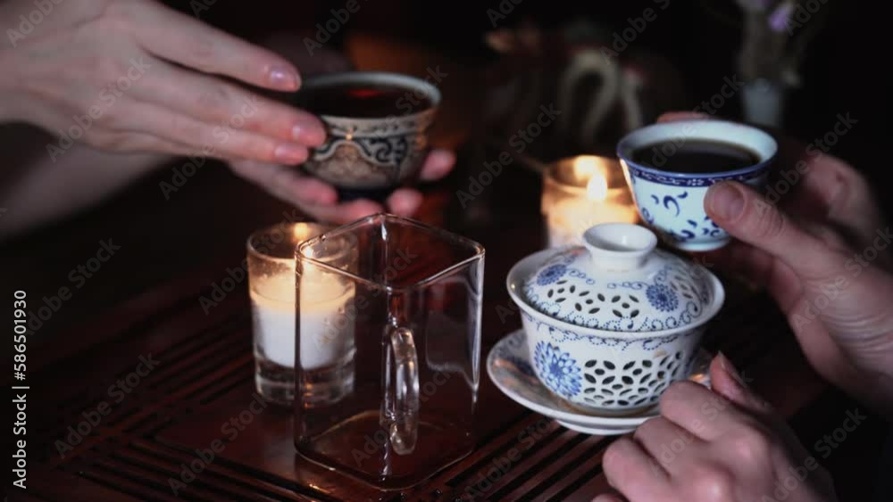 female visitor holds bowl of hot drink in her hands and interacts with ...