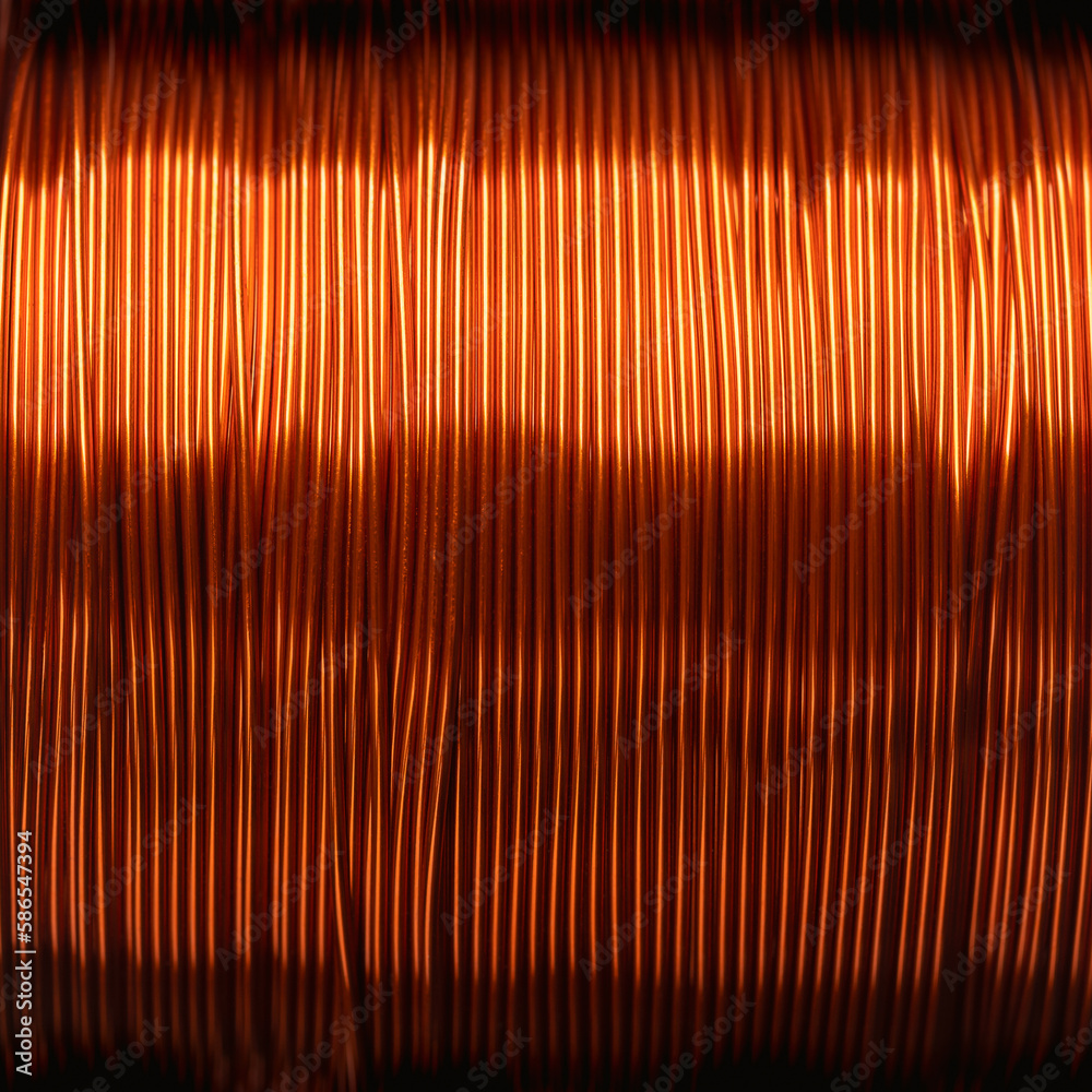 Copper wire, enamelled, on a coil, close up. Double coated and ...