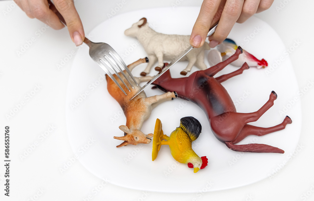farm animals plastic toys in white plate and woman female hands holding ...