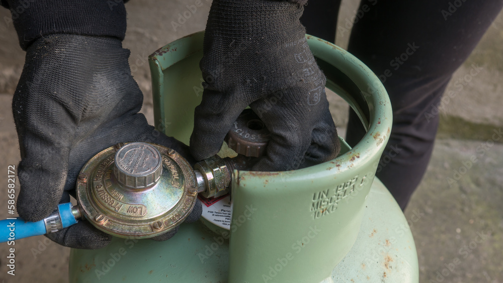 LPG cylinder connection with pressure regulator. close-up of a ...