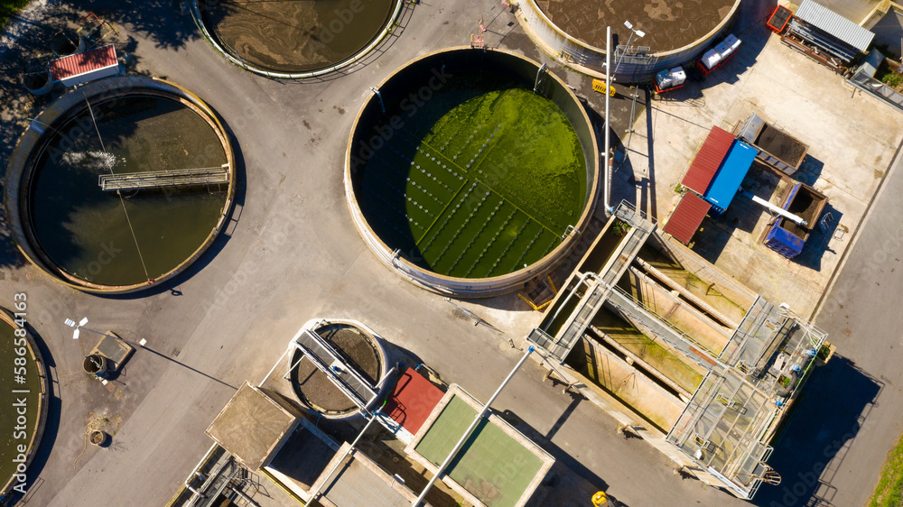 Aerial view of the tanks of a sewage and water treatment plant enabling ...