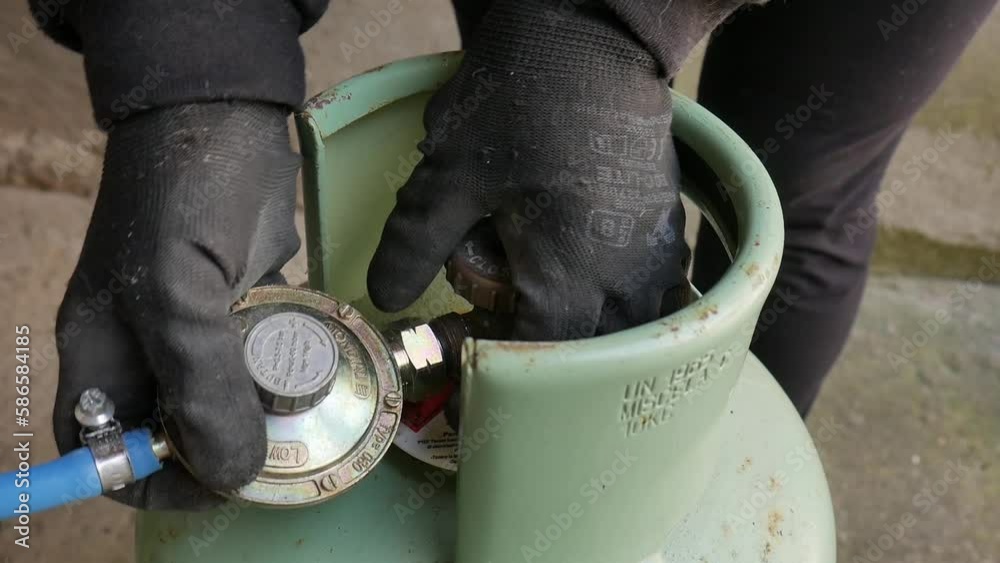 LPG cylinder connection with pressure regulator. close-up of a ...
