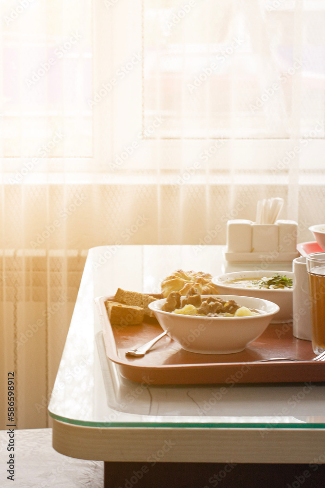a tray of food on the table before eating in a food service close-up ...