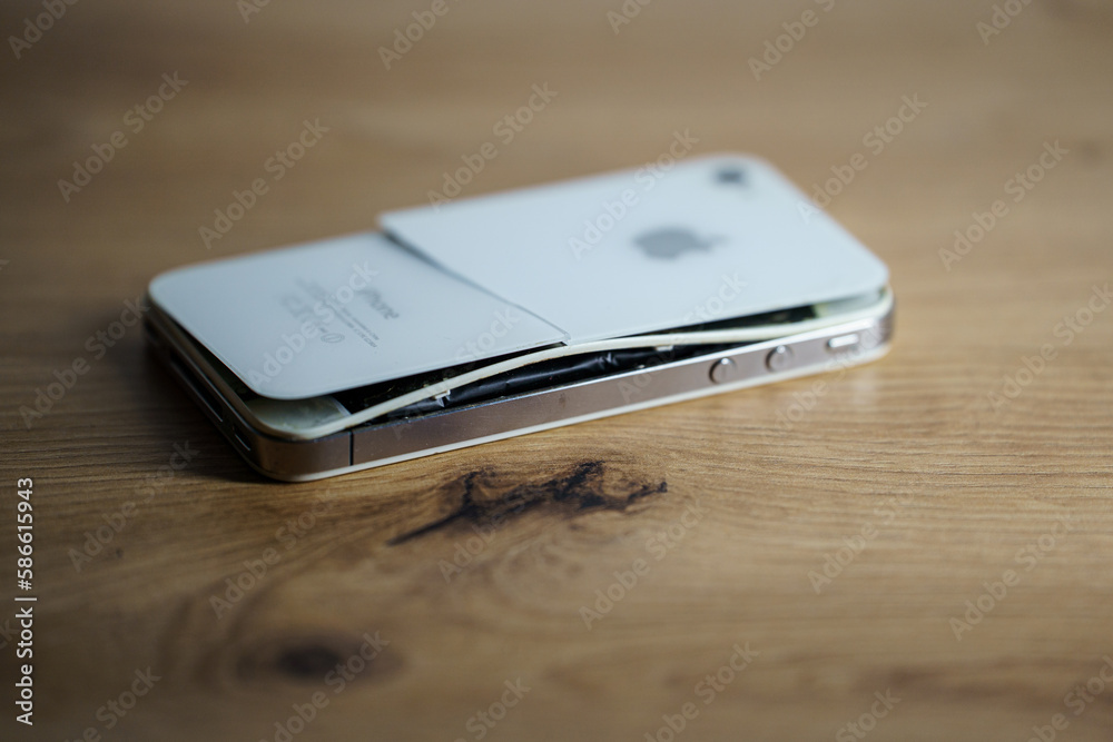 Iphone with exploded Lithium-ion battery. Li-ion swollen battery Stock ...