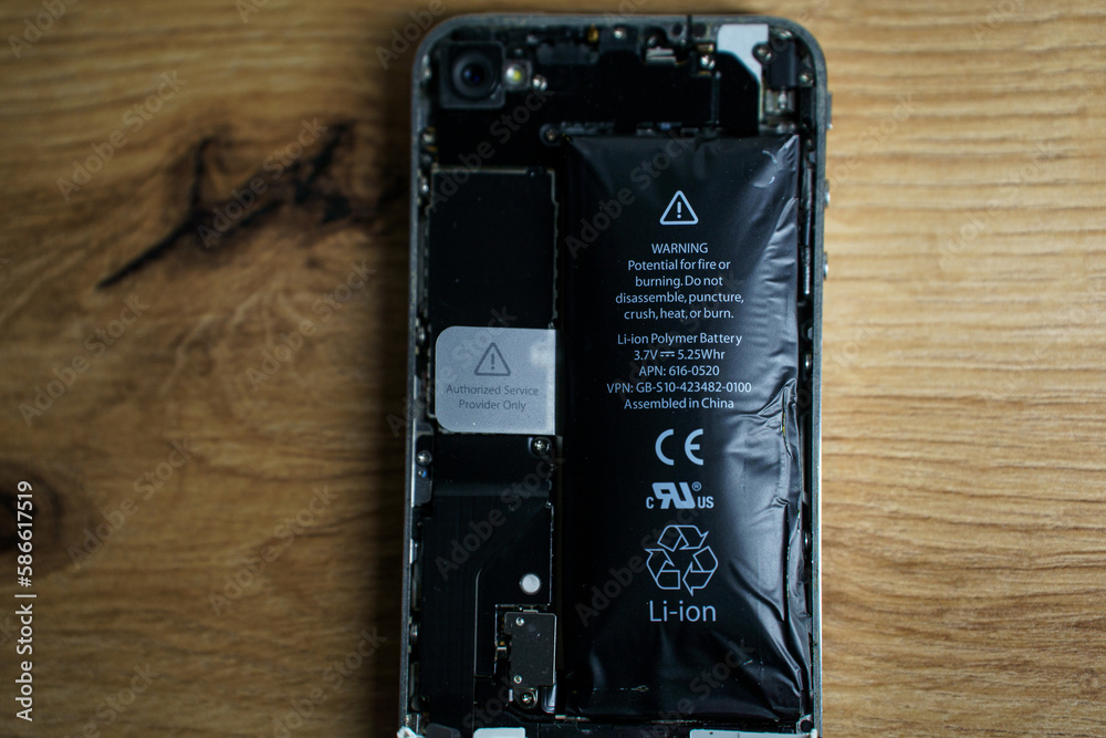 Foto de Iphone with exploded Lithium-ion battery. Li-ion swollen ...