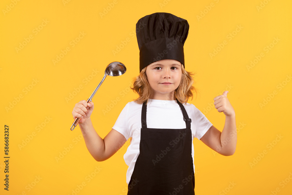 Funny kid chef cook with kitchen ladle, studio portrait. Child chef ...