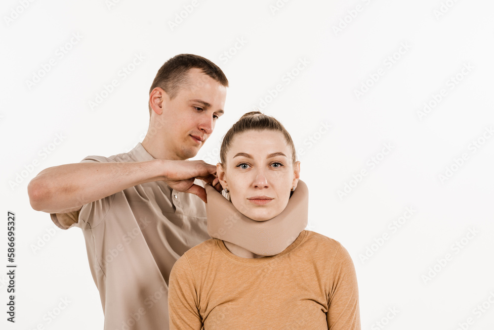 Neurosurgeon puts neck bandage on girl to stabilize the cervical region ...