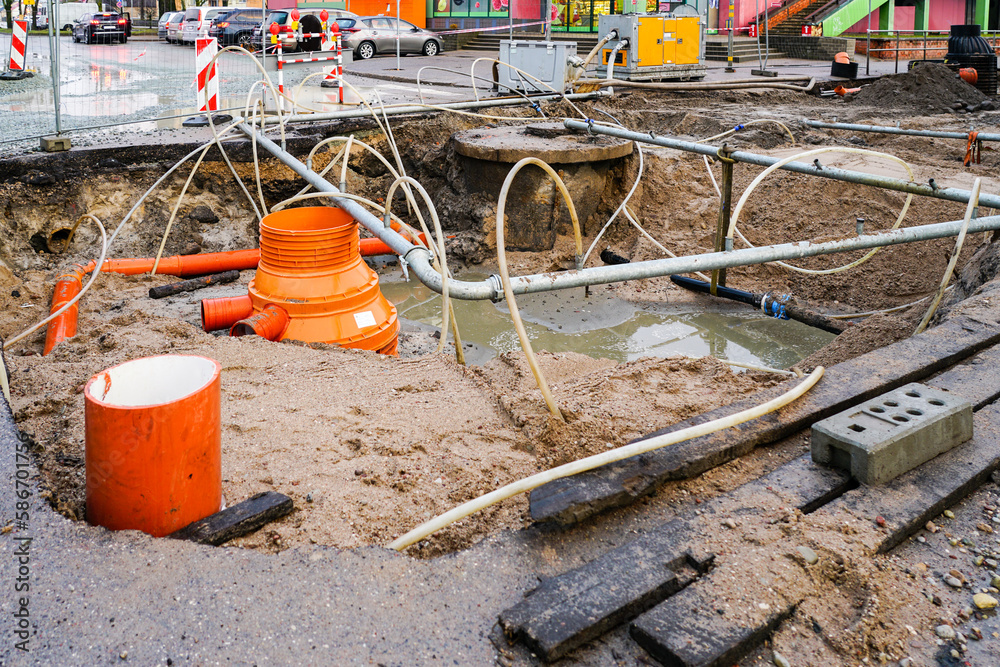 Replacement of underground communications pipes in the city street ...