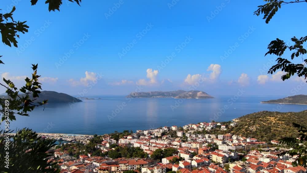 Drone flying between trees towards the view of Kaş and Meis Island ...