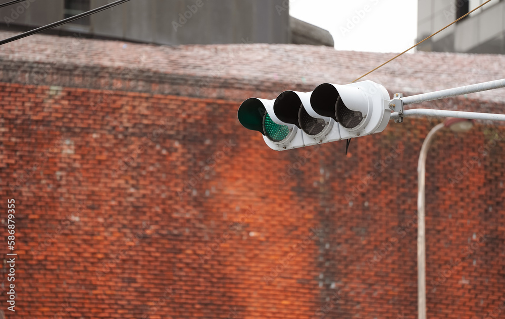 Traffic lights on standing poles over a large intersection on the ...