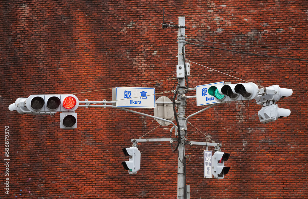 Traffic lights on standing poles over a large intersection on the ...