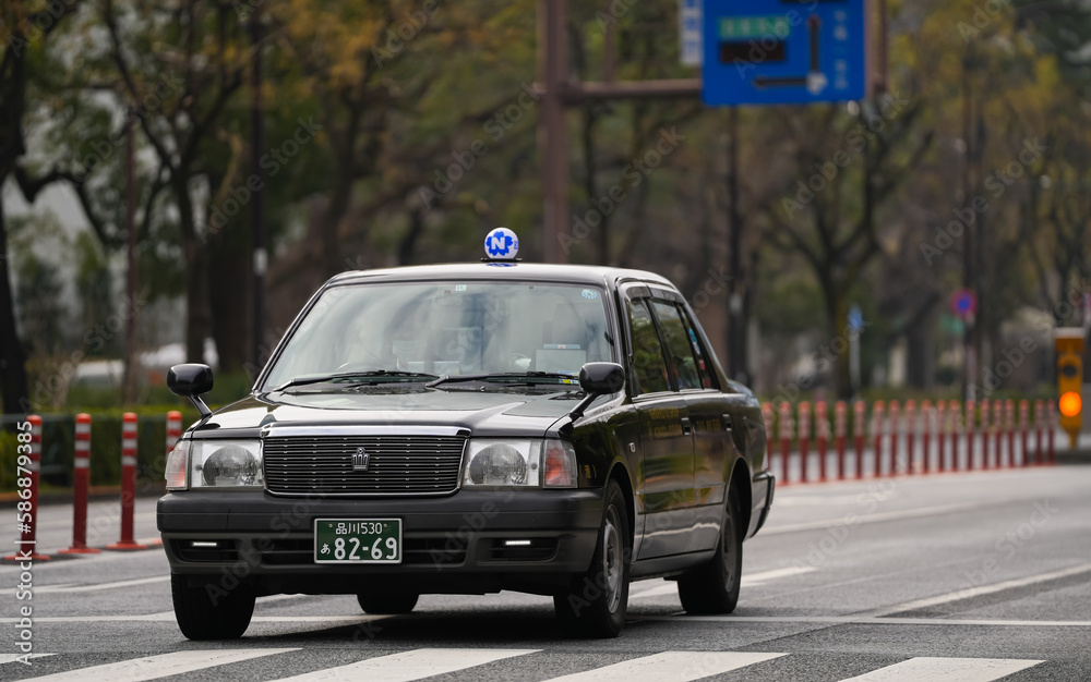 Tokyo taxi. Photo with a black cab car as a taxi on the streets of ...