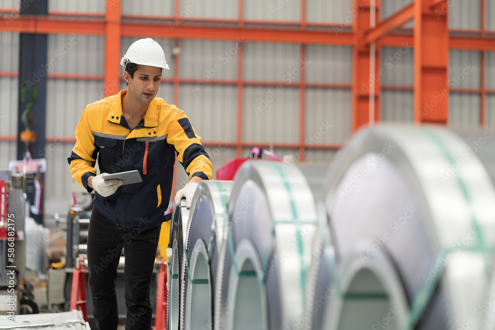 Metalwork manufacturing, warehouse of raw materials. Male factory ...