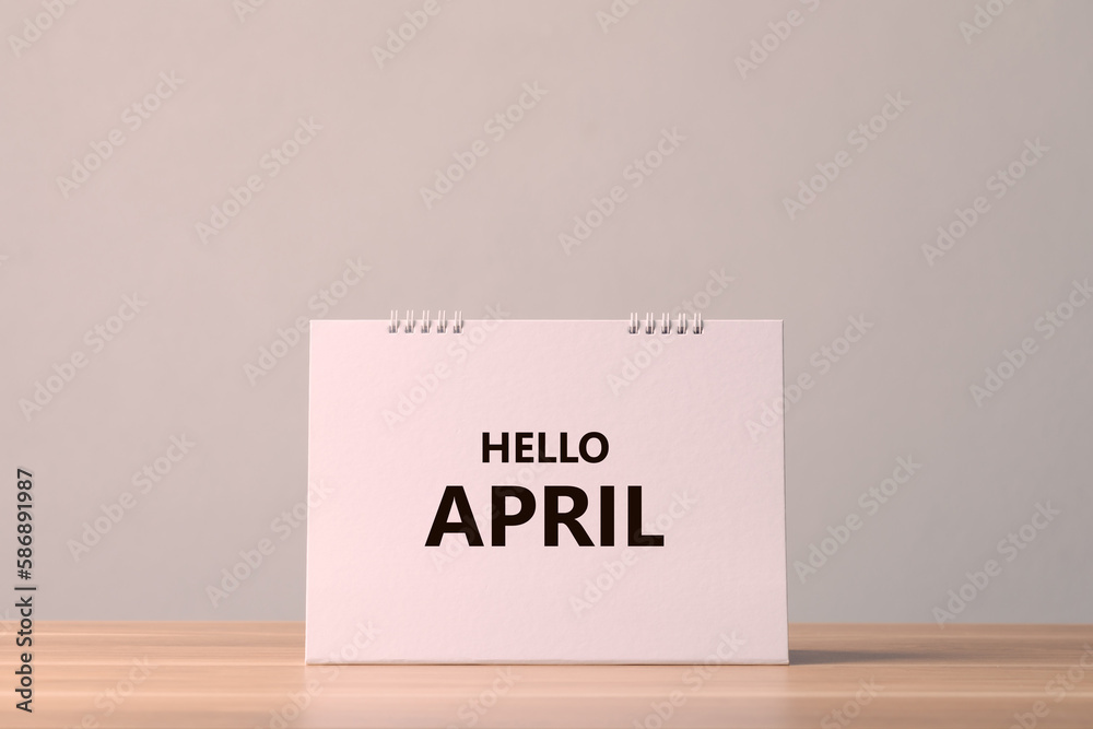 Start to new month concept, Paper desk calendar with text HELLO APRIL ...