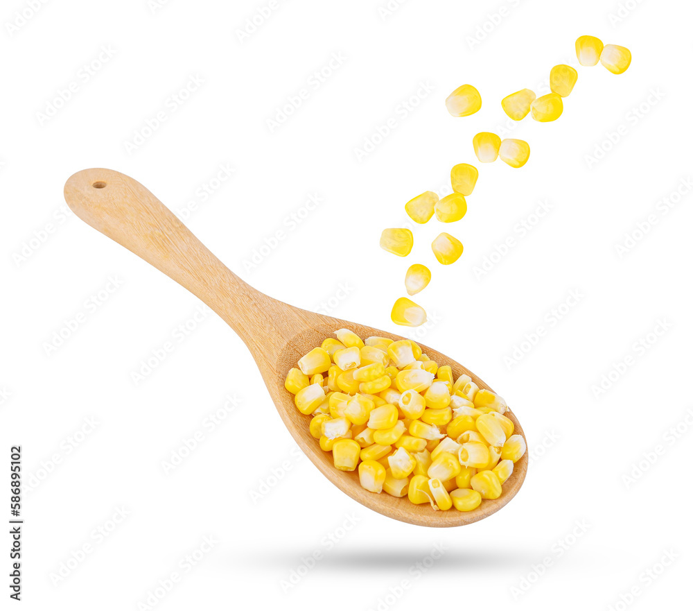 Corn seeds in wooden spoon falling in the air isolated on transparent ...