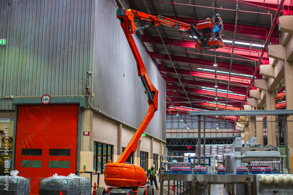 Workers working on the construction site of the new factory industry ...