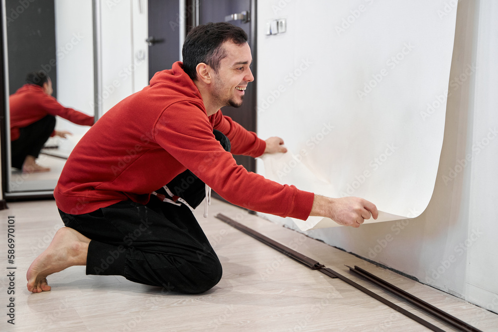 Repair the house with their own hands. The guy is ripping the old ...