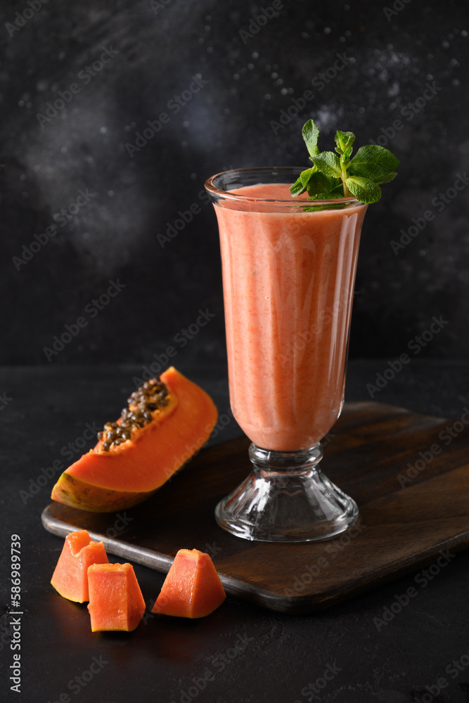One glass of Papaya lassi on black background. Freshness cold beverage ...