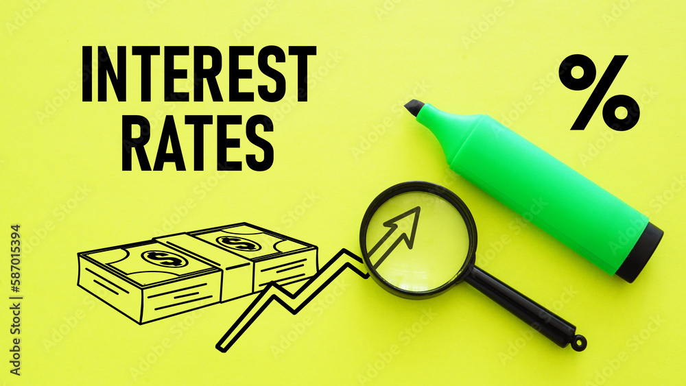 Interest rates are shown using the text and photo of magnifying glass ...