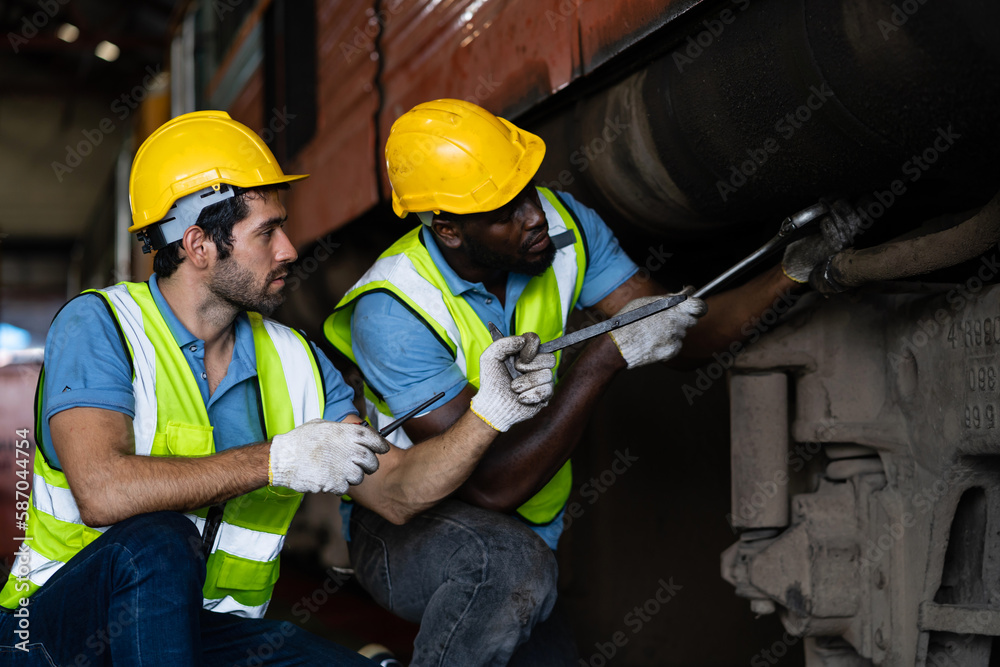 Railway engineer. Professional mechanic wearing safety helmet working ...