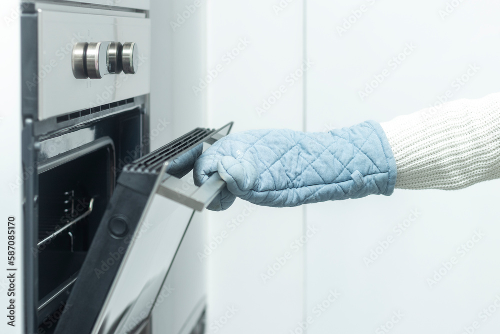 Preparing a Delicious Baked Meal: Gloved Hand Opens the Oven Stock ...
