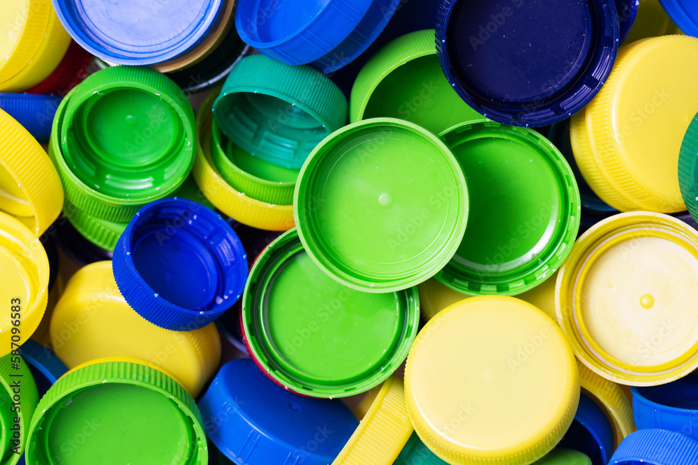 Plastic bottle caps background. Collecting bottle caps texture. Yellow ...