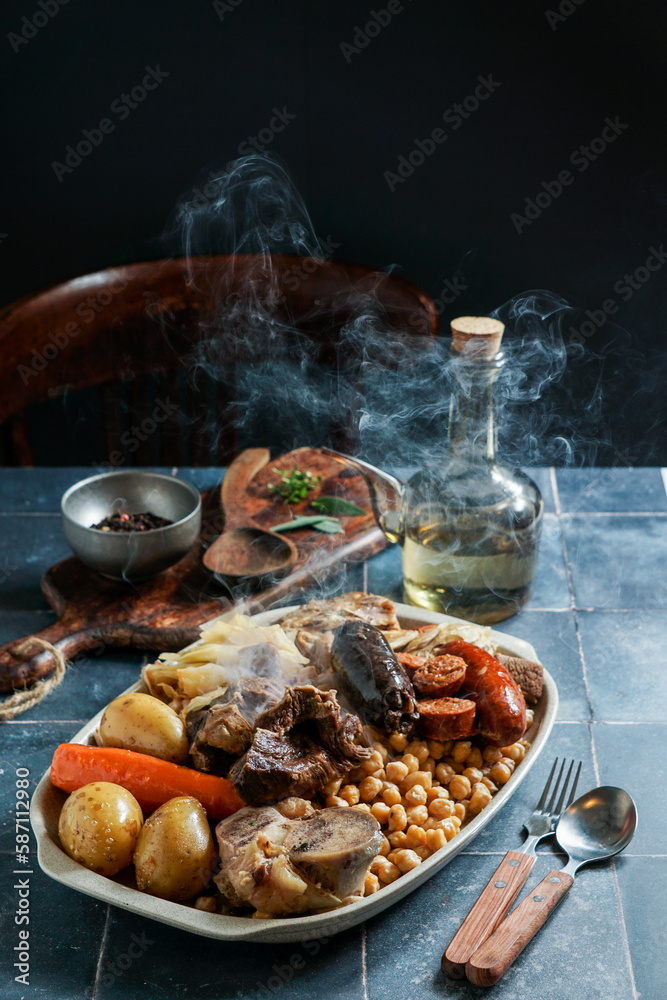 Cocido Madrileño, a traditional Spanish meal, chickpea-based stew from ...