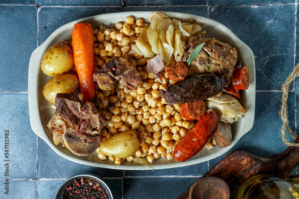 Cocido Madrileño, a traditional Spanish meal, chickpea-based stew from ...