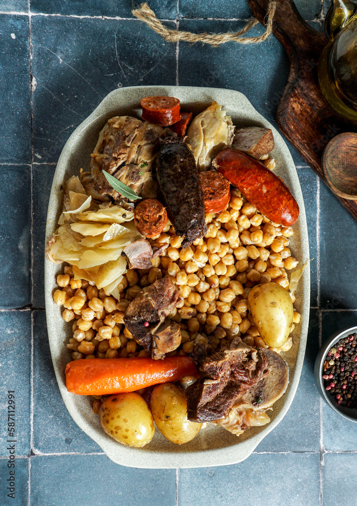 Cocido Madrileño, a traditional Spanish meal, chickpea-based stew from ...