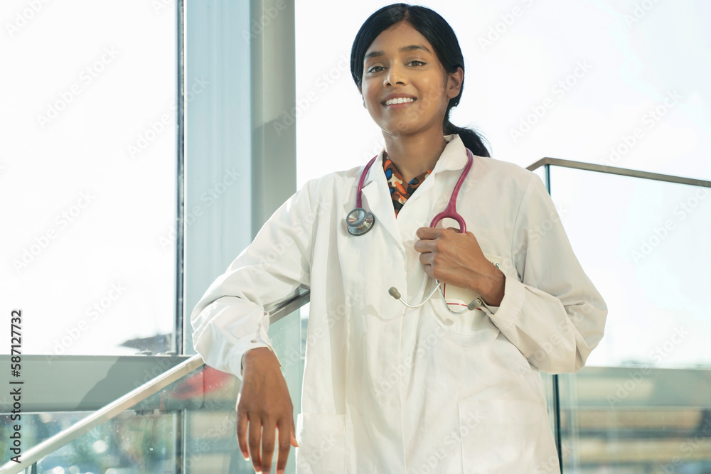 Portrait of smiling medical student looking at camera in university ...