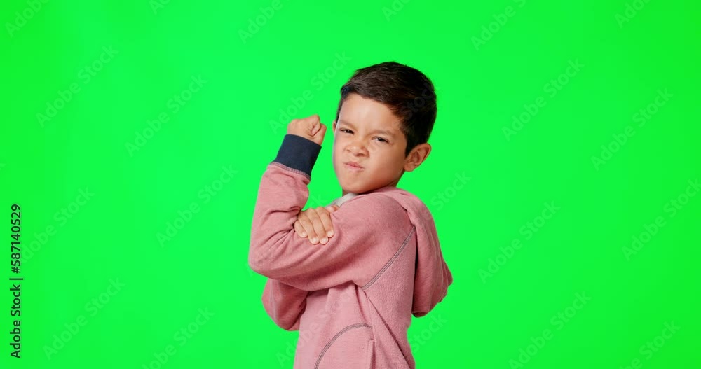 Strong, face and child in a studio with green screen flexing his arm ...