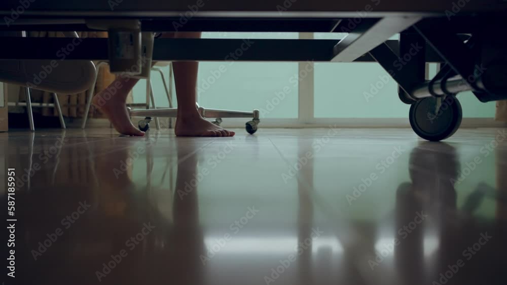 Close-up foot girl walking with drip bag in hospital room. medicine ...