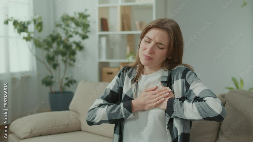 Woman has Got the Symptoms of Heart Attack.Breathing Problems, Chest ...