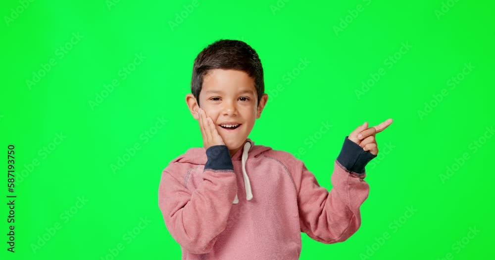 Surprise, pointing and notification with a boy on a green screen ...