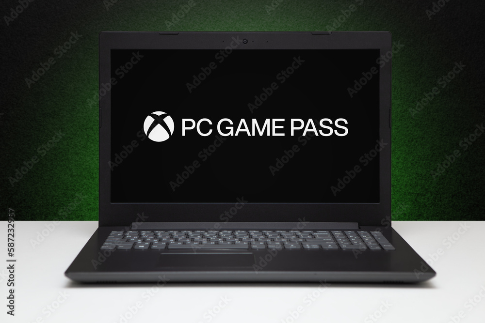Foto de PC Game Pass logo on screen laptop computer on black textured ...