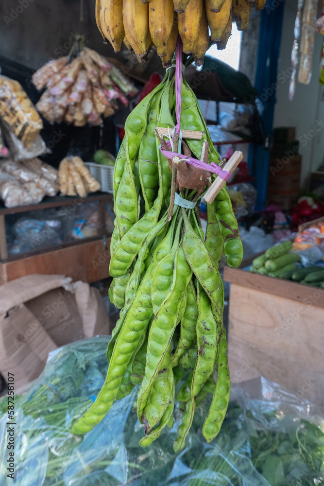 Petai, petai or mlanding (Parkia speciosa) are hung and sold in ...