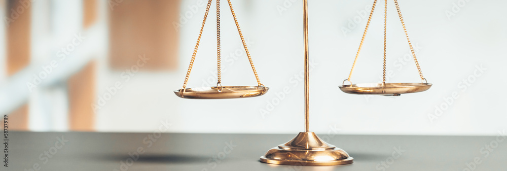 Shiny golden balanced scale in court library background as concept ...