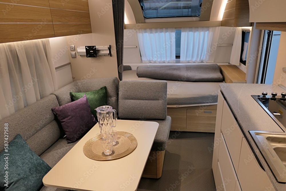 Interior with dining table, kitchen corners and bedroom in modern ...