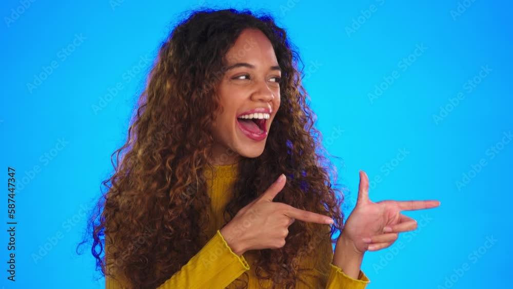 Woman, gun fingers and pointing in studio with smile, happiness and ...