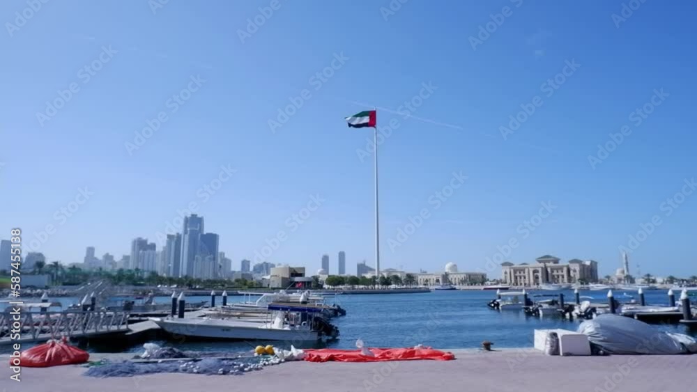 Sharjah, the UAE flag flies from a huge pole in the sky over Flag ...