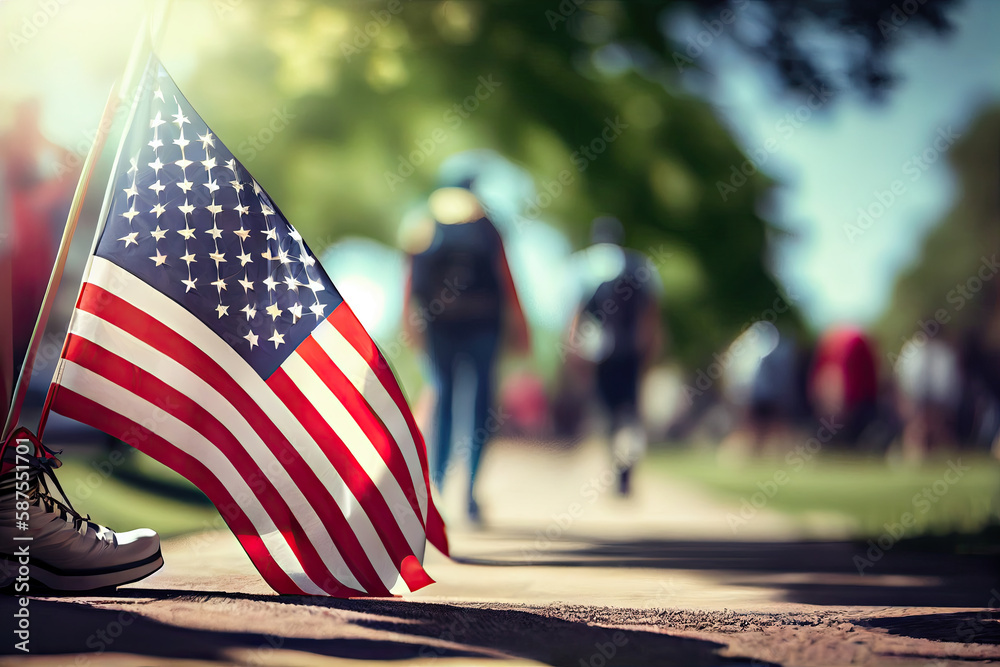 an american flag on the ground with people walking in the background ...